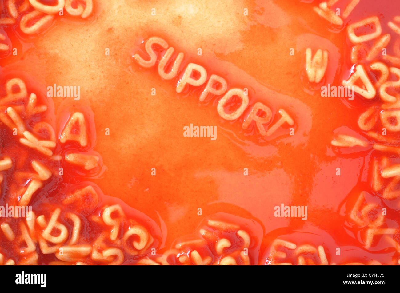 support or help concept with red pasta snack Stock Photo - Alamy