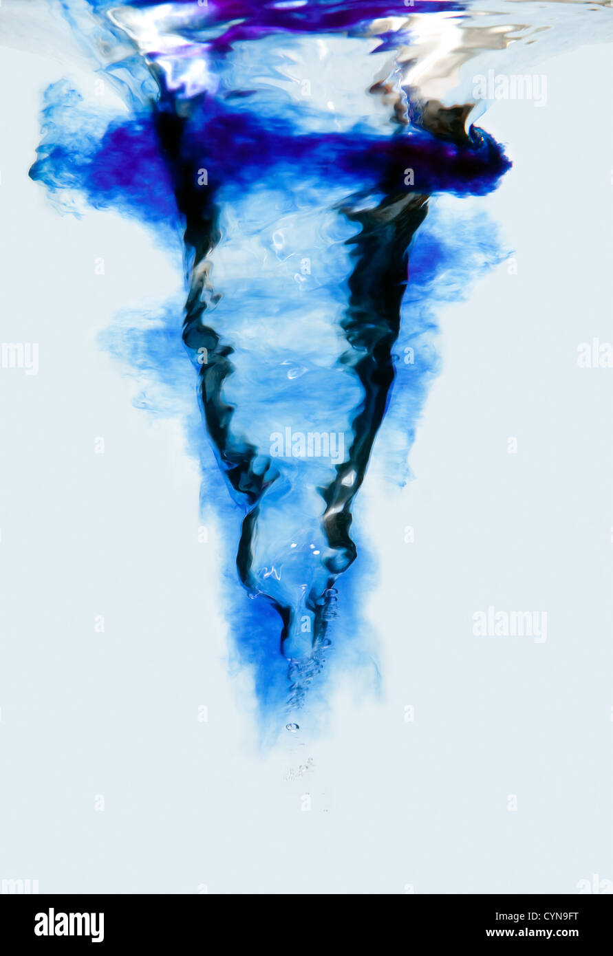 Side view of an underwater vortex swirl with bubbles and blue ink ...