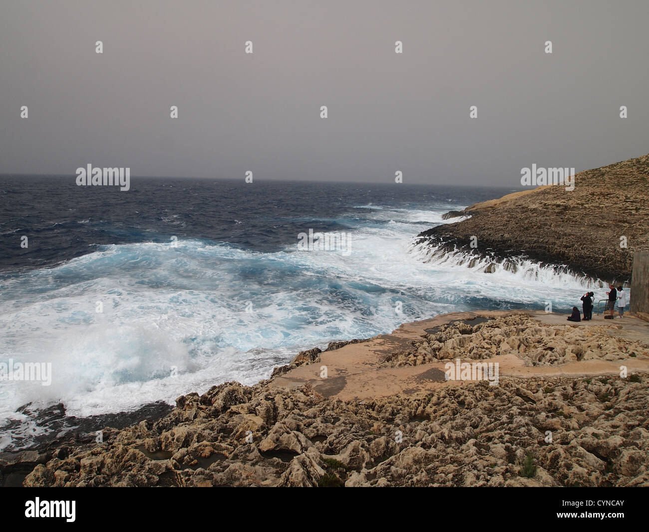 Rocky coast and wavy sea Stock Photo - Alamy