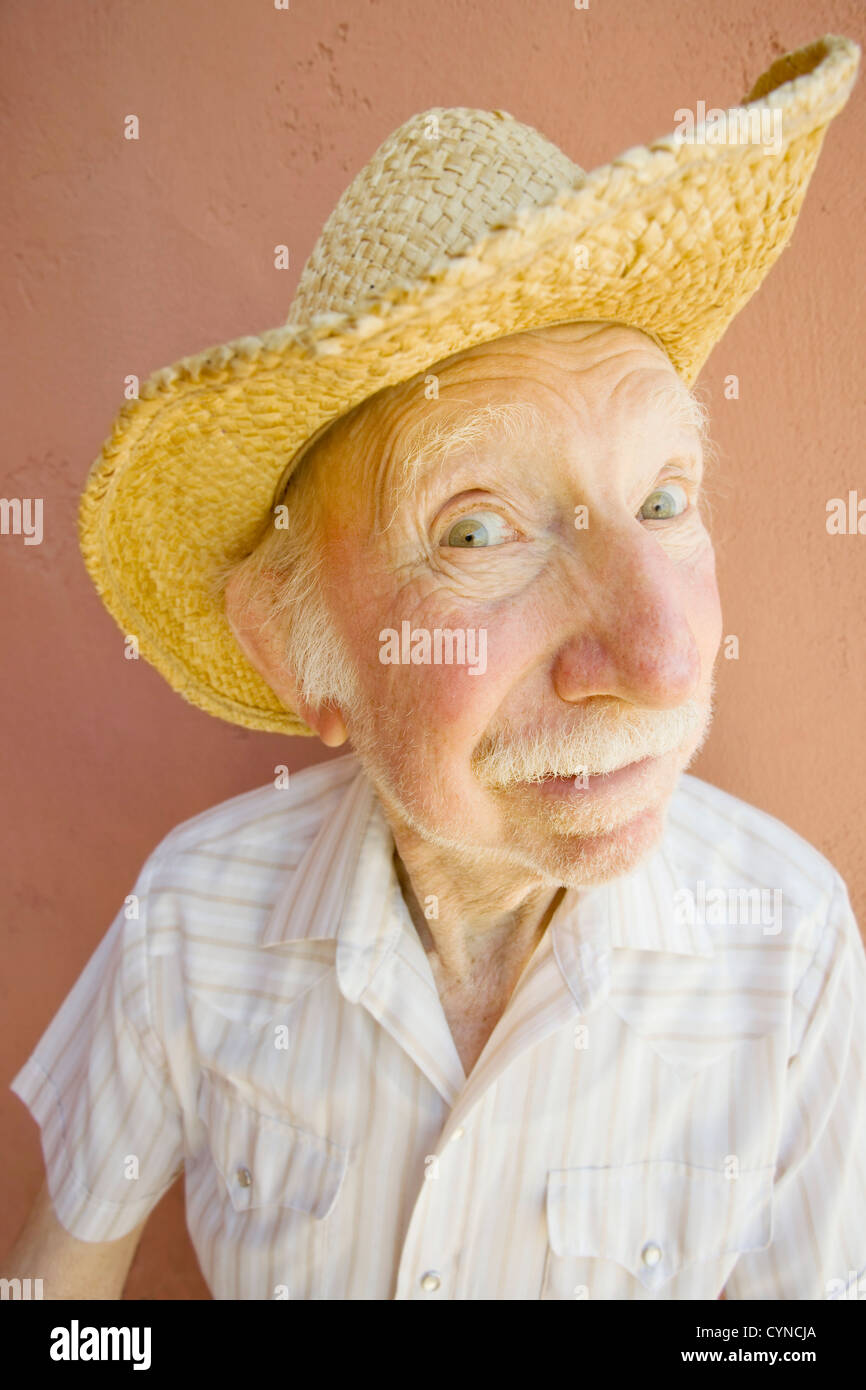 Senior Citizen Man with a Funny Expression Wearing a Straw Cowboy Hat ...