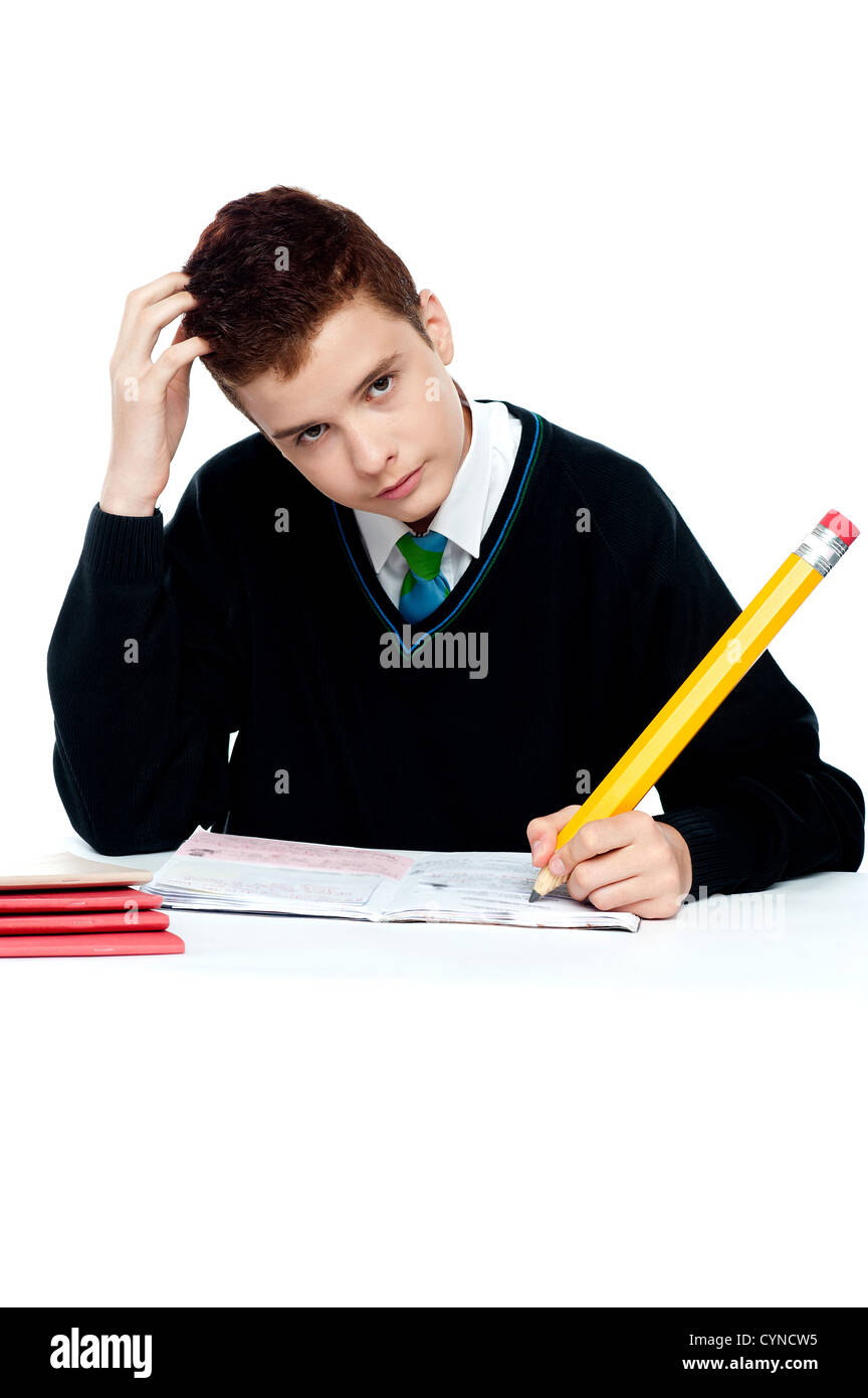 Confused worried young school boy thinking about homework Stock Photo ...