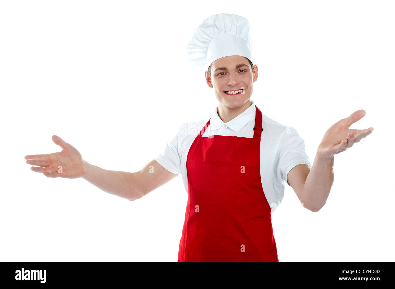 Handsome carefree male chef in a welcoming gesture isolated on white ...