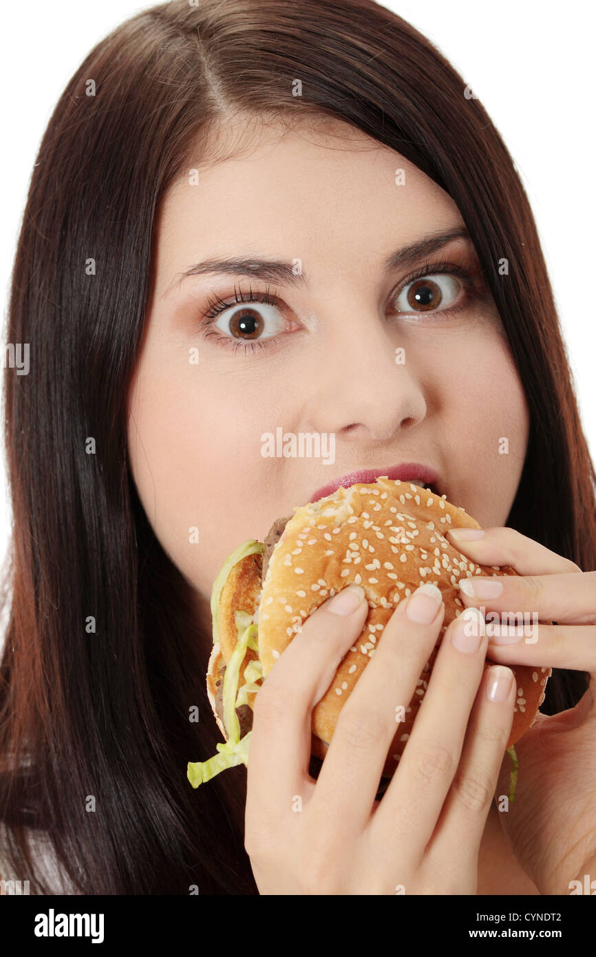 Beautiful caucasian woman eating hamburger. Isolated on white Stock ...