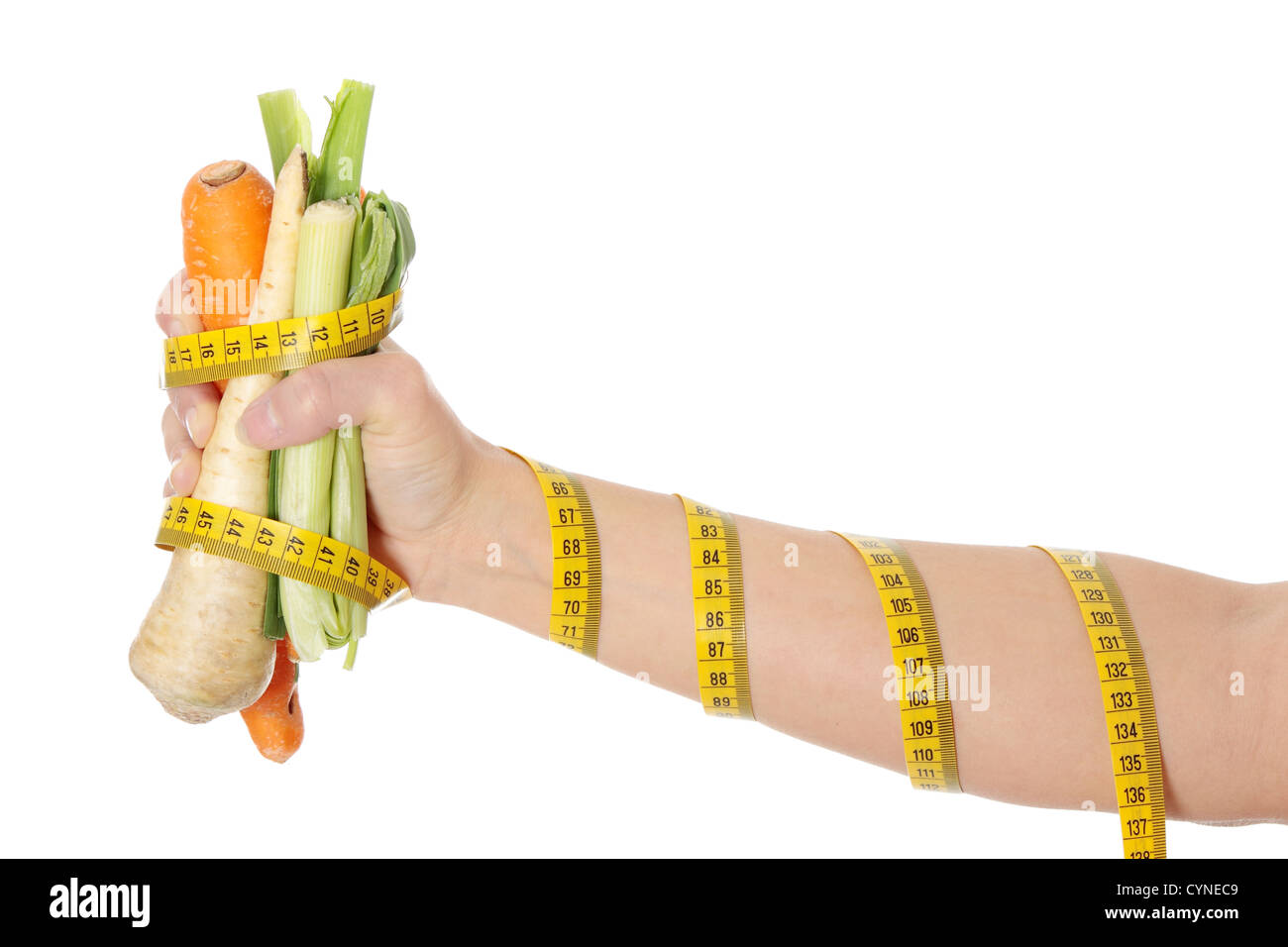Woman's hand holding vegetables and measuring tape, isolated on white ...