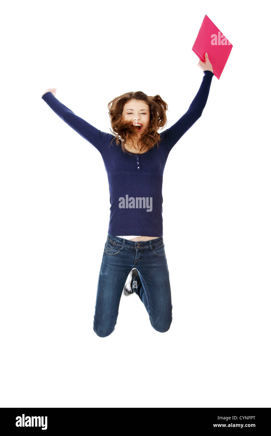 Jumping happy teen student girl Stock Photo - Alamy