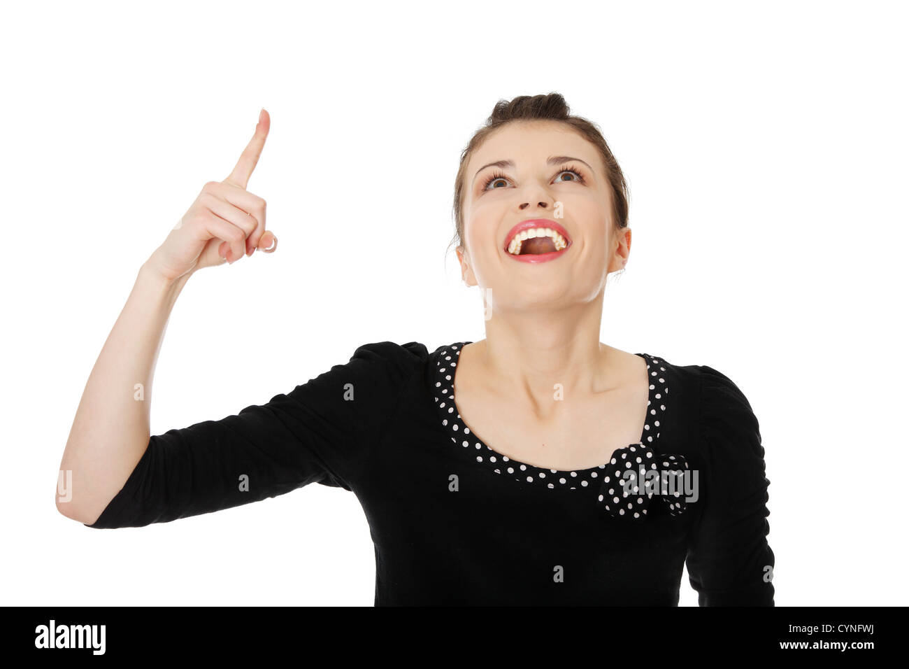 Young beautiful happy caucasian woman pointing up Stock Photo - Alamy