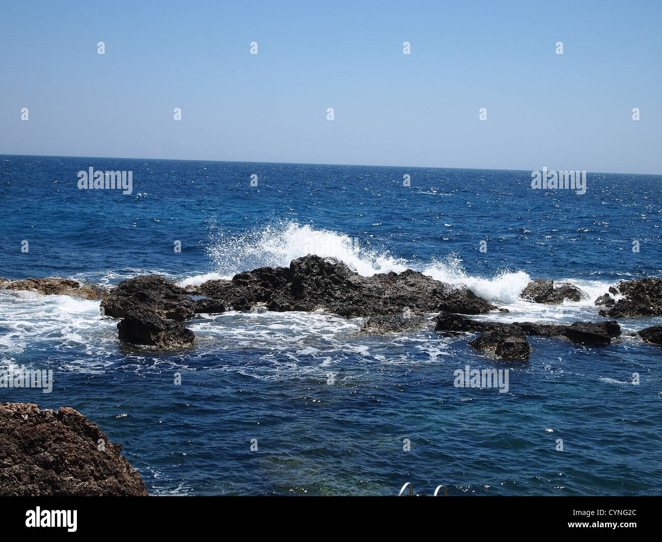 Waves at rocky coast Stock Photo - Alamy
