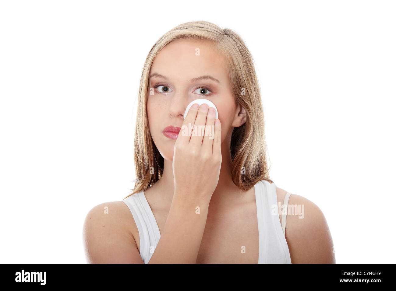 Teen woman removing makeup Stock Photo - Alamy