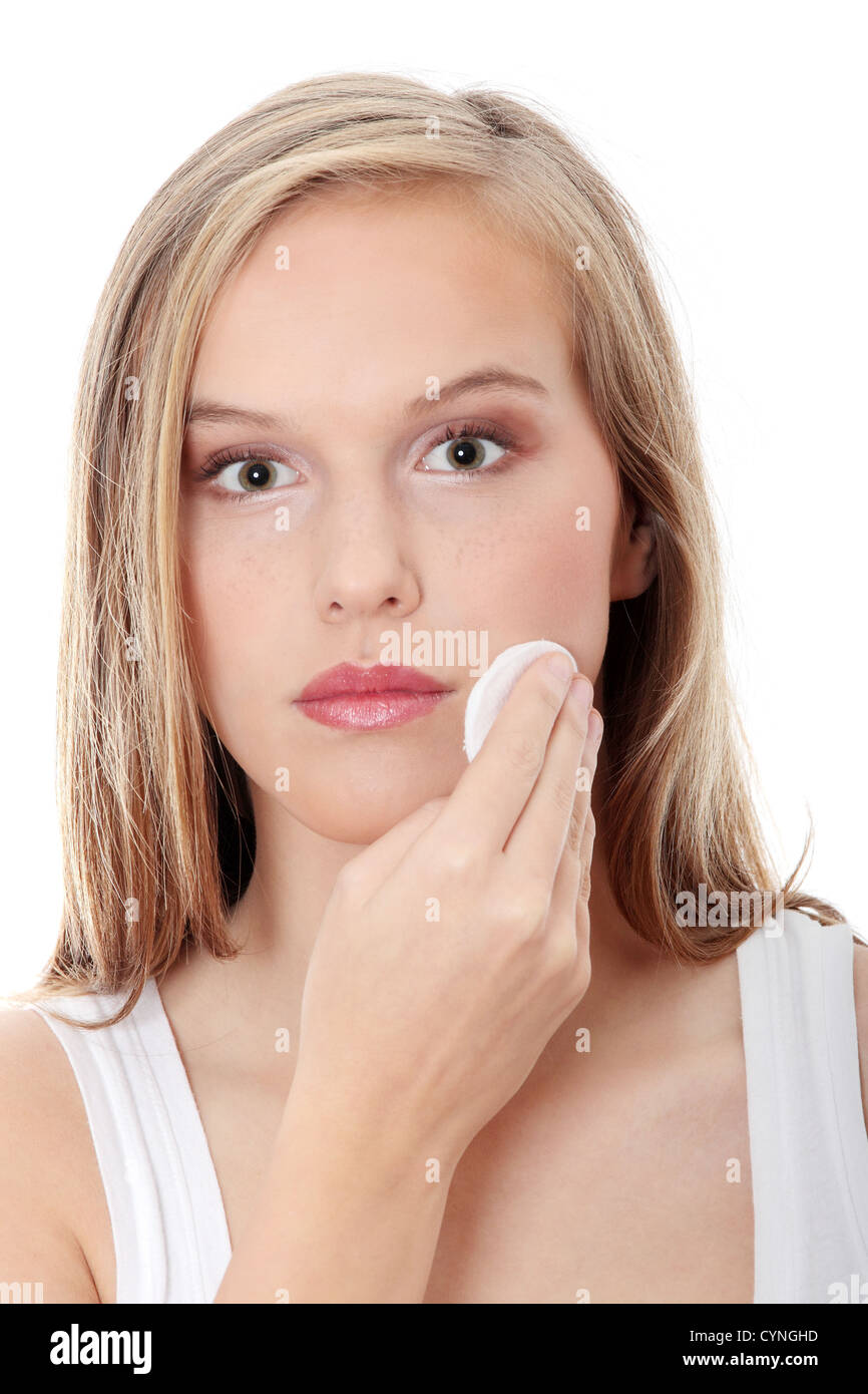 Teen woman removing makeup Stock Photo - Alamy