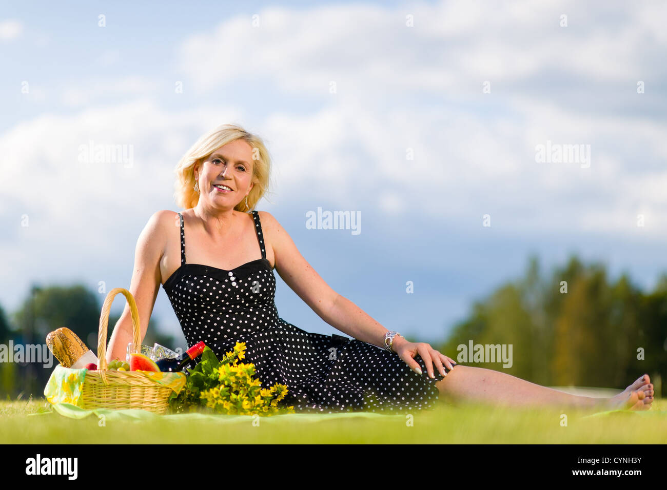 Happy woman enjoying the beautiful weather at the picnic Stock Photo ...