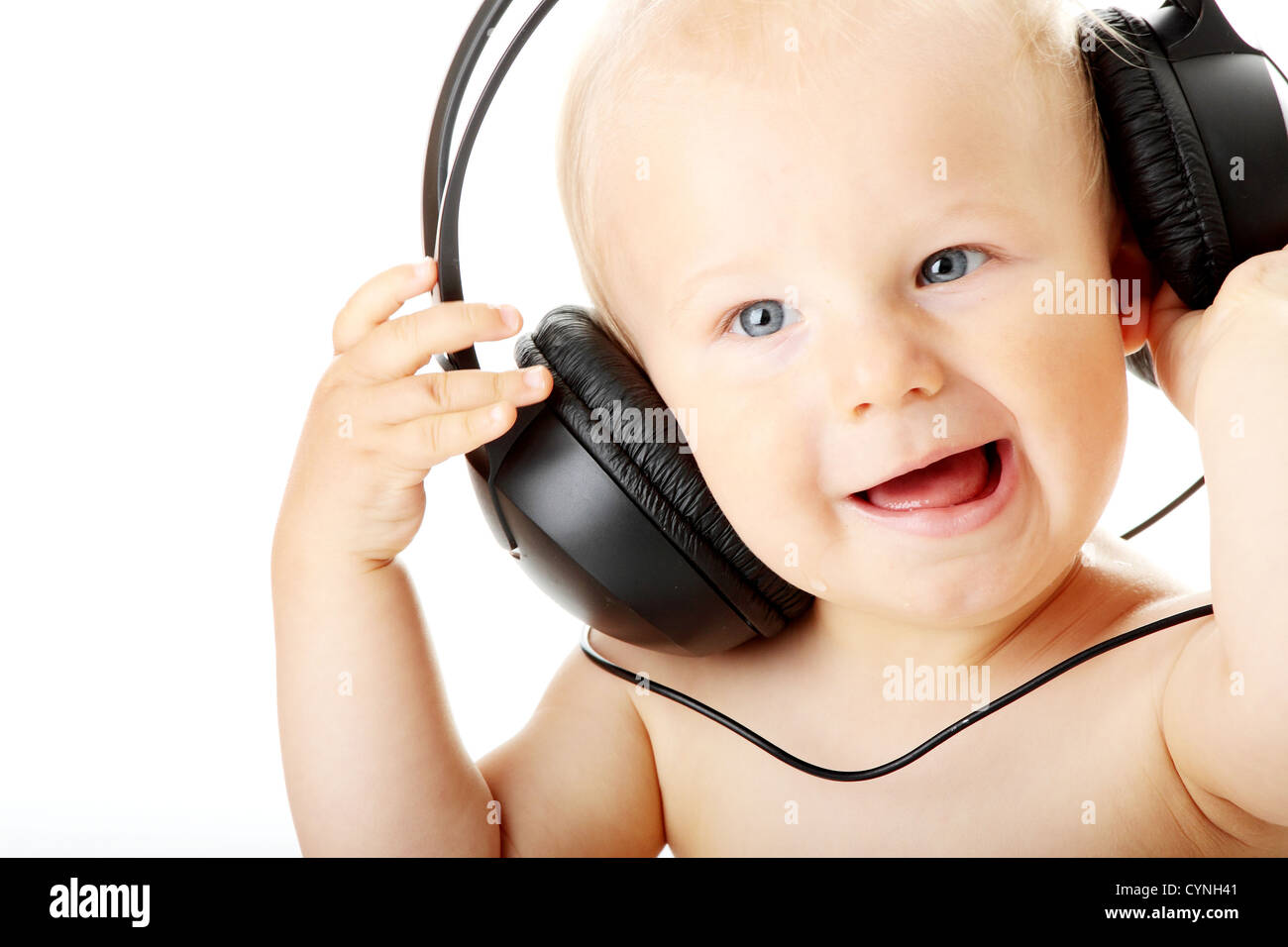 Smiling baby with headphone Stock Photo - Alamy
