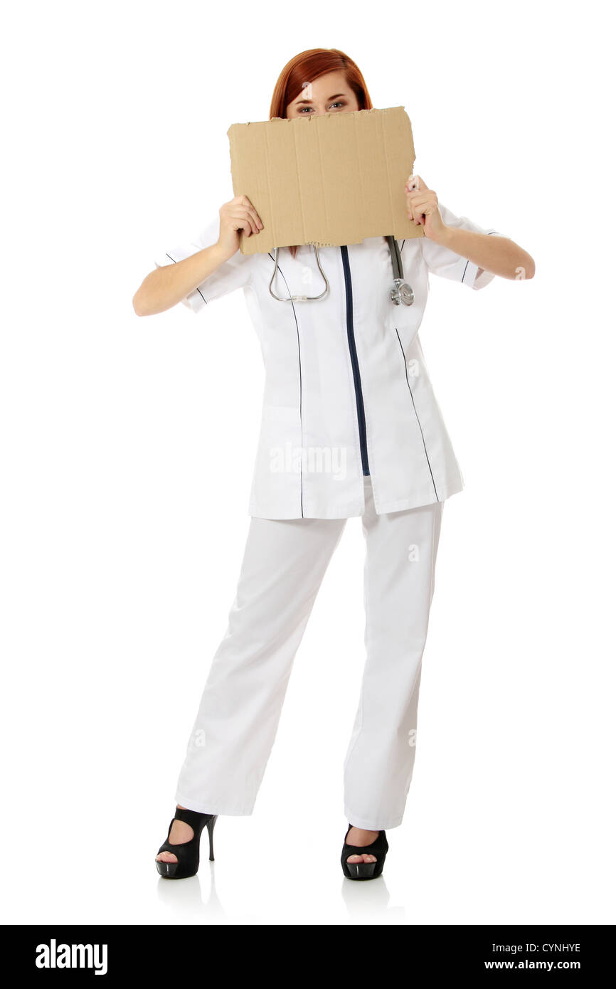 Unemployed female doctor with empty cardboard sign , isolated on white ...
