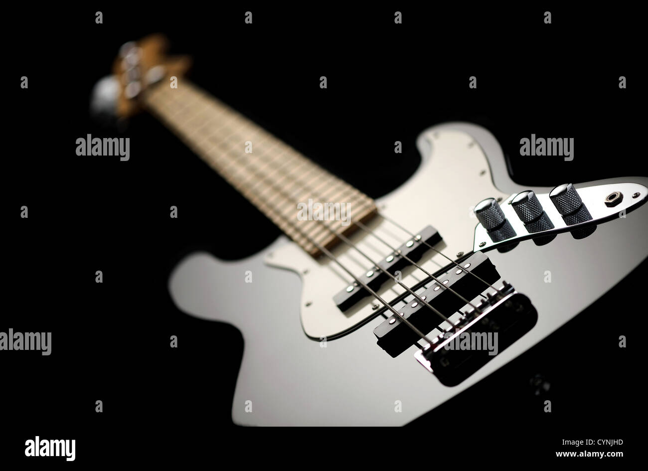 close up of a black electric bass glossy on dark background Stock Photo ...