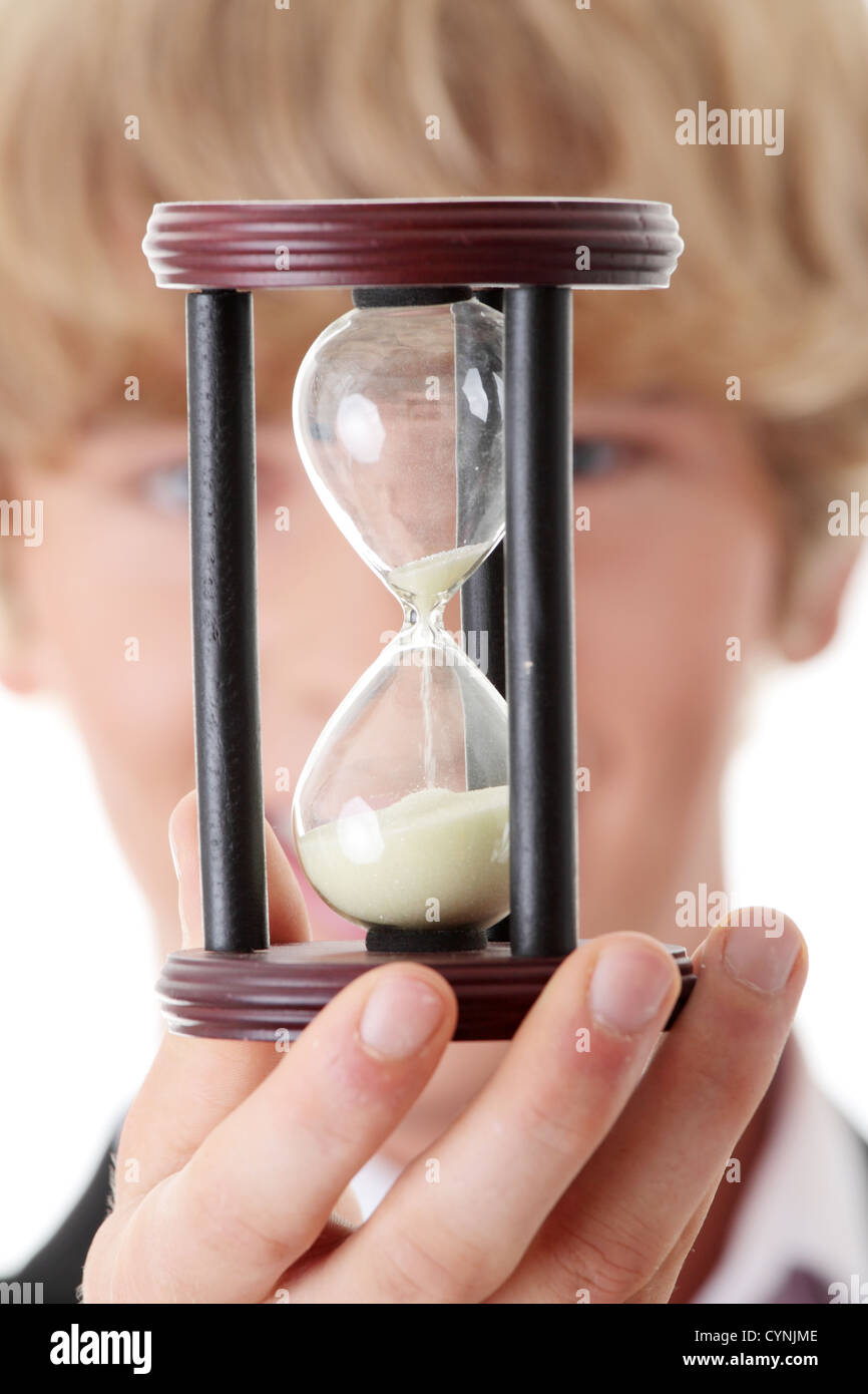 Businessman showing how to save time Stock Photo - Alamy