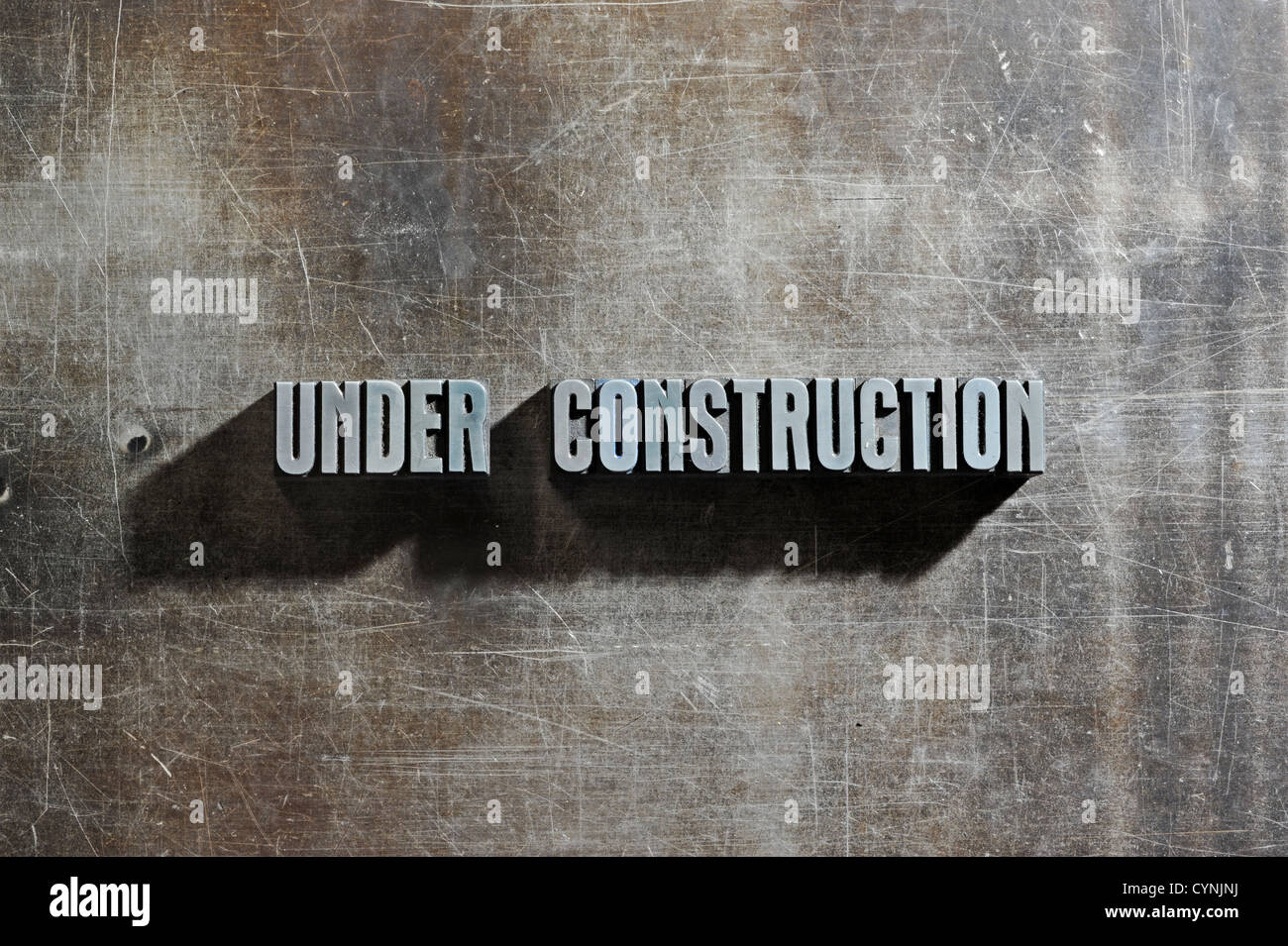 Image of a Under Construction sign with a metallic background texture ...