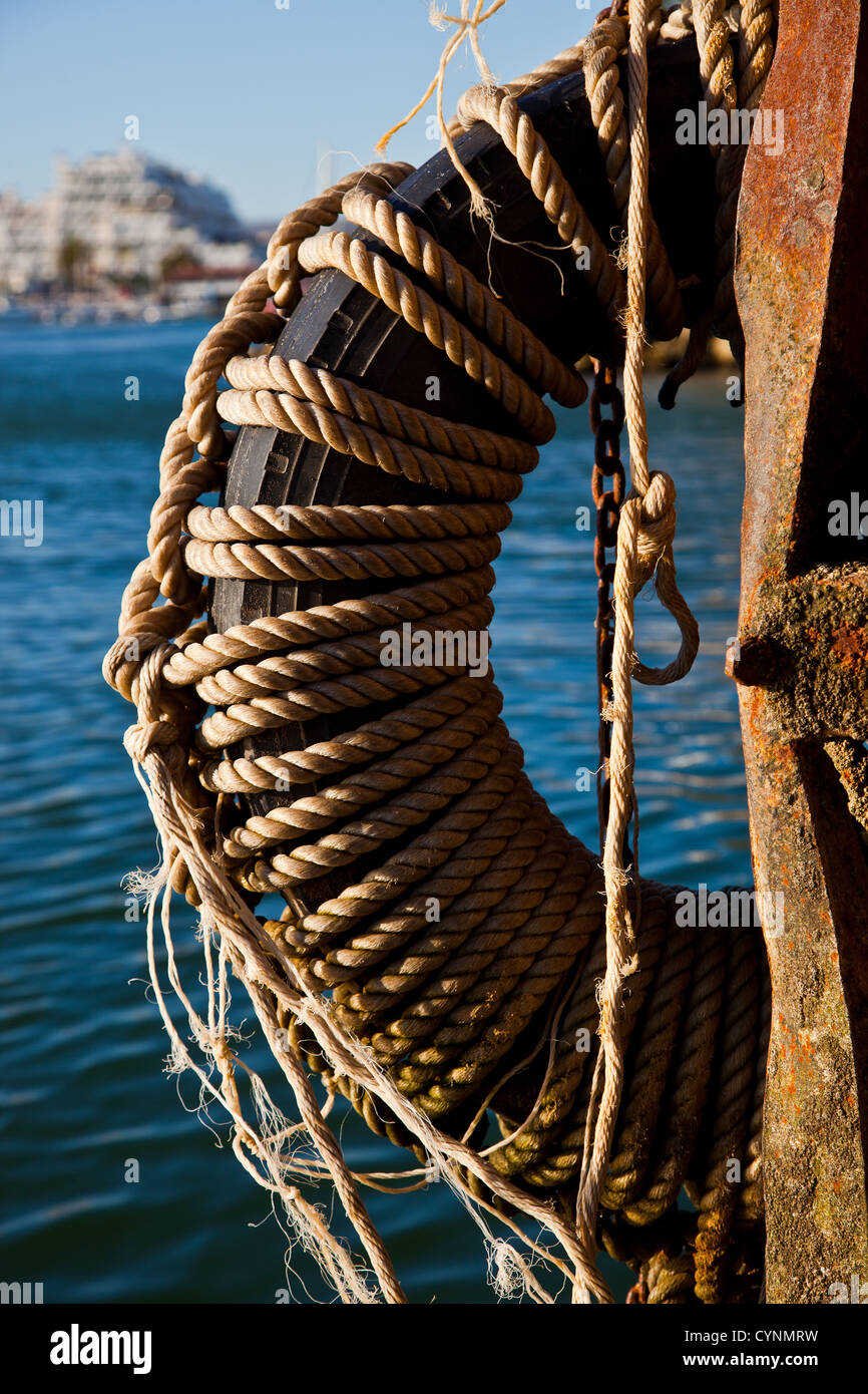 Tyre/tire boat defender strapped to a pier in Vilamoura, Portugal Stock ...