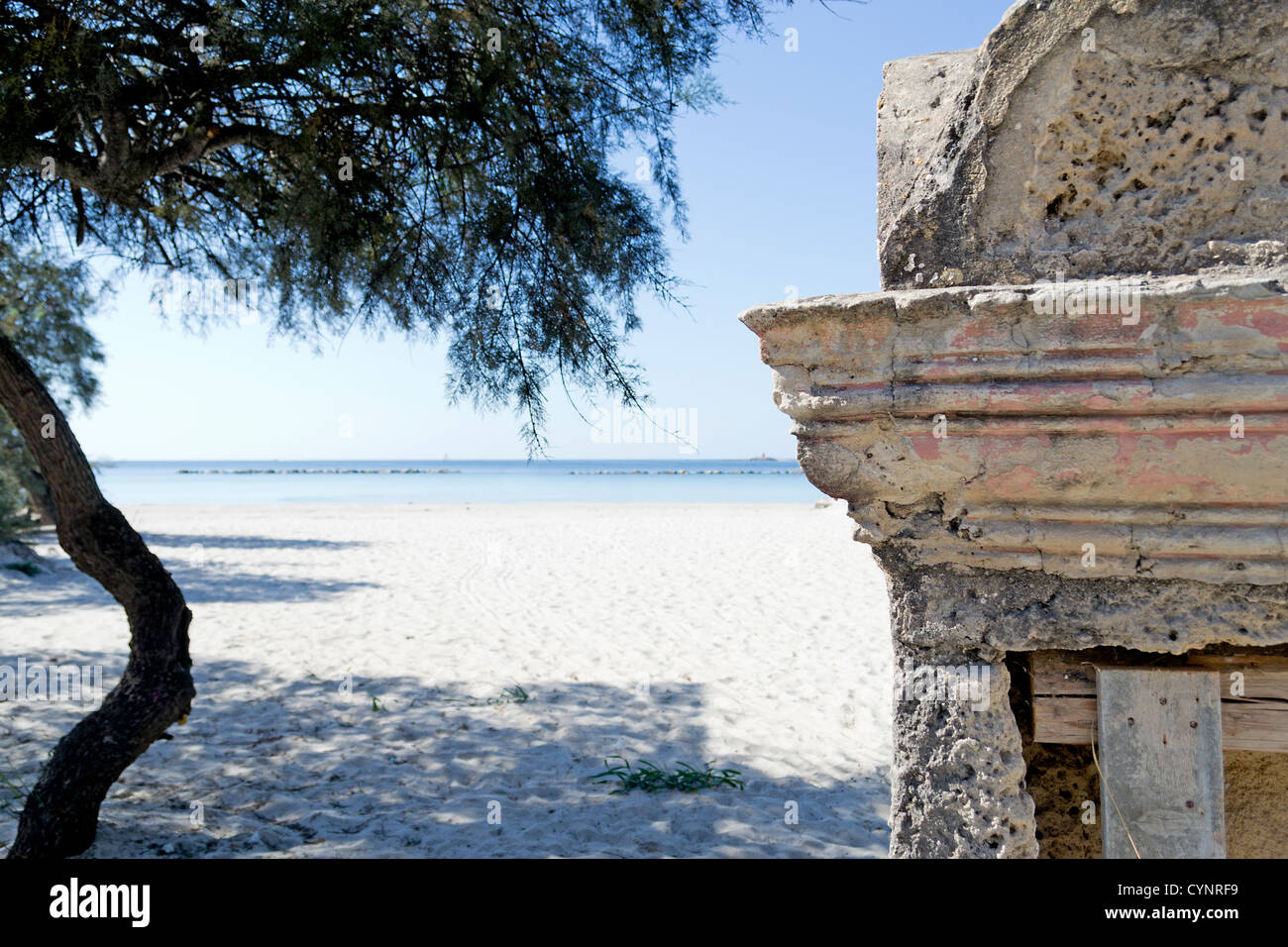 small stone column on a white sand beach Stock Photo - Alamy