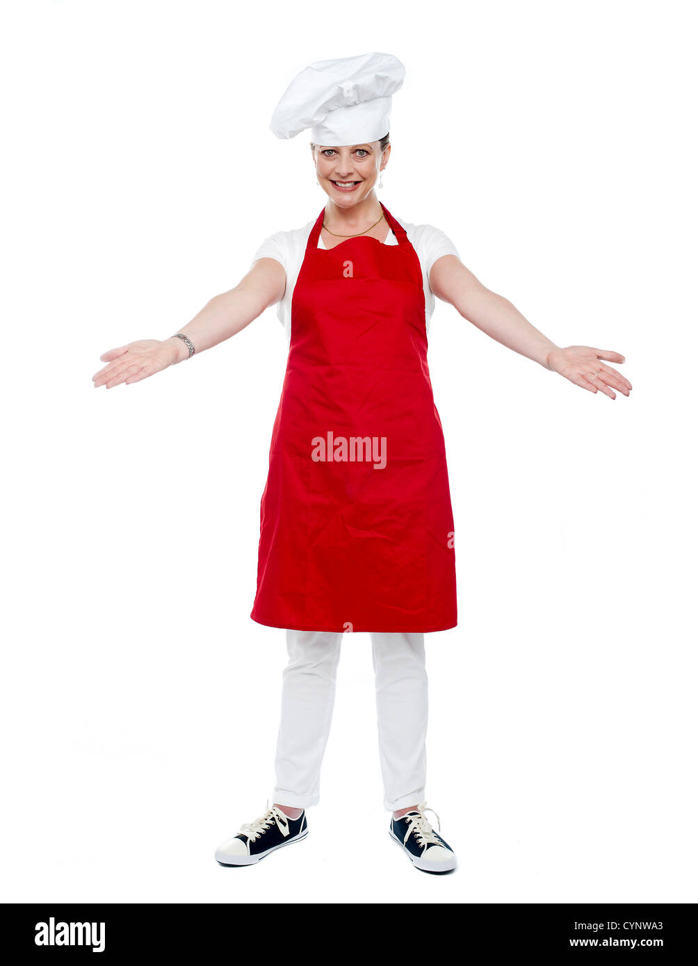 Full length portrait of chef posing in uniform with her arms wide open ...