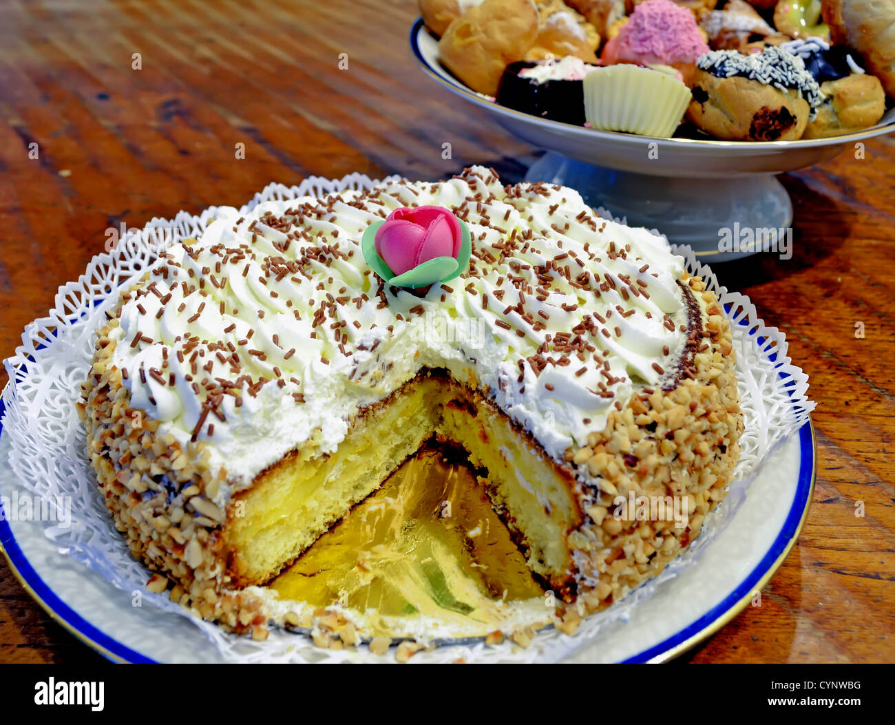 Chantilly cake with pastries in the background Stock Photo - Alamy