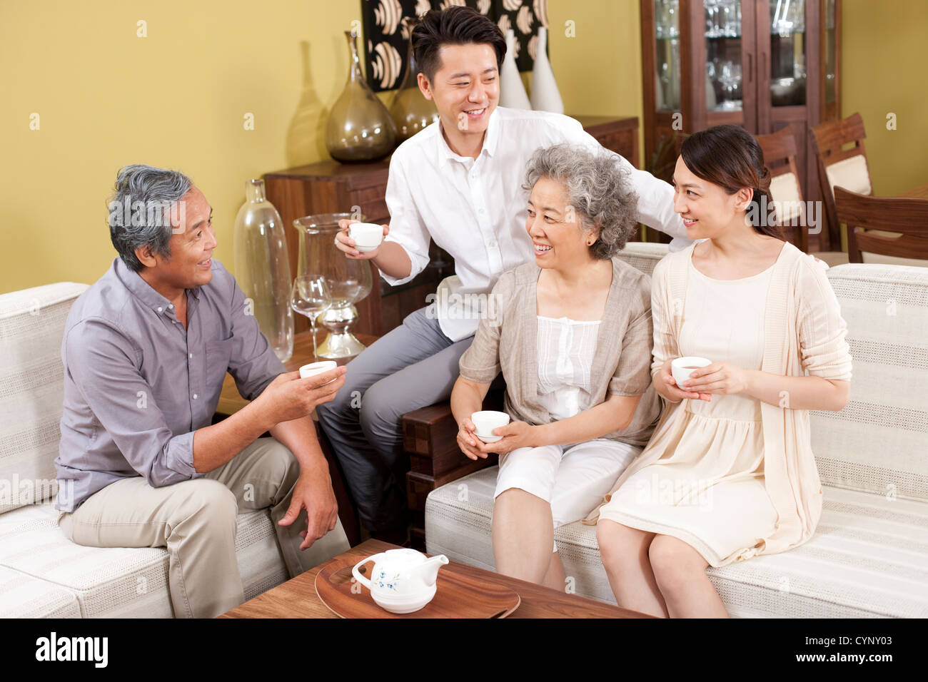 Family having tea together Stock Photo - Alamy