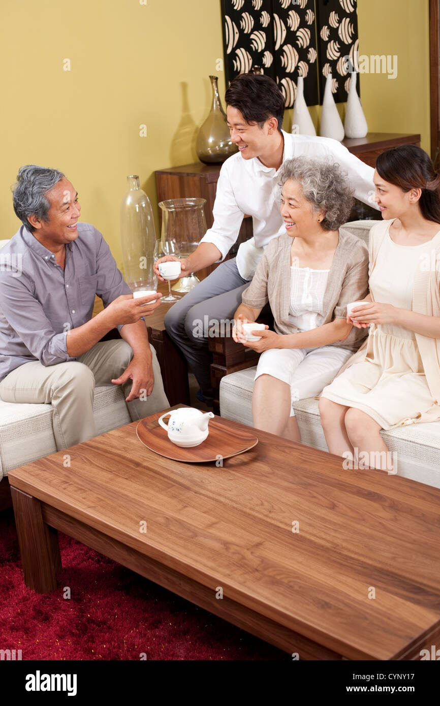 Family having tea together Stock Photo - Alamy