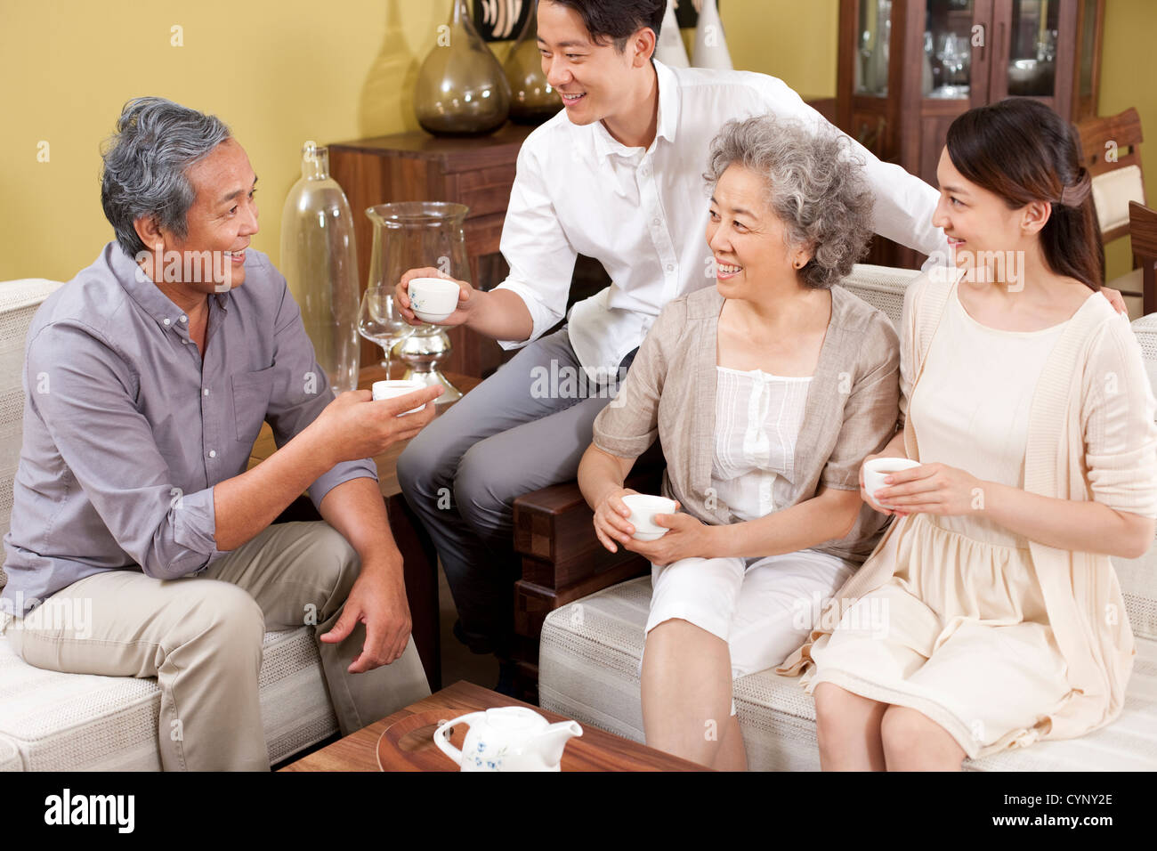 Family having tea together Stock Photo - Alamy