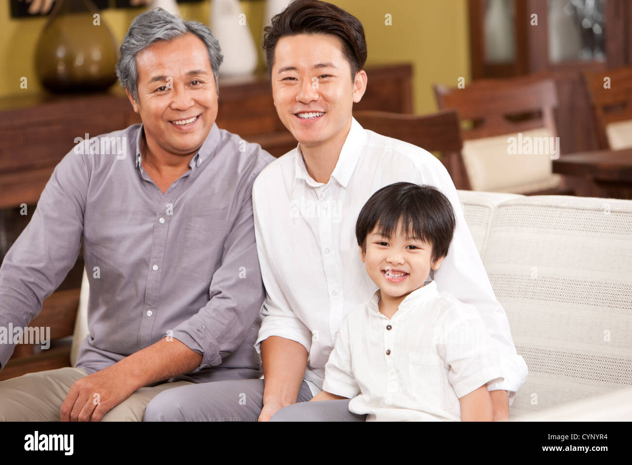 Portrait of three generations of men Stock Photo - Alamy