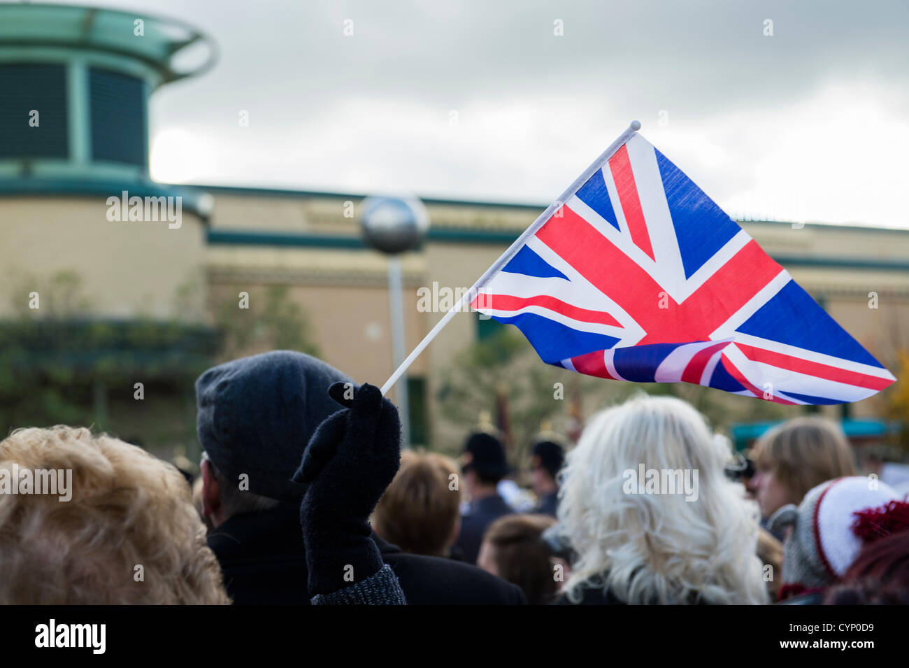 A proud and patriotic crowd watches a parade by the Royal Anglian ...