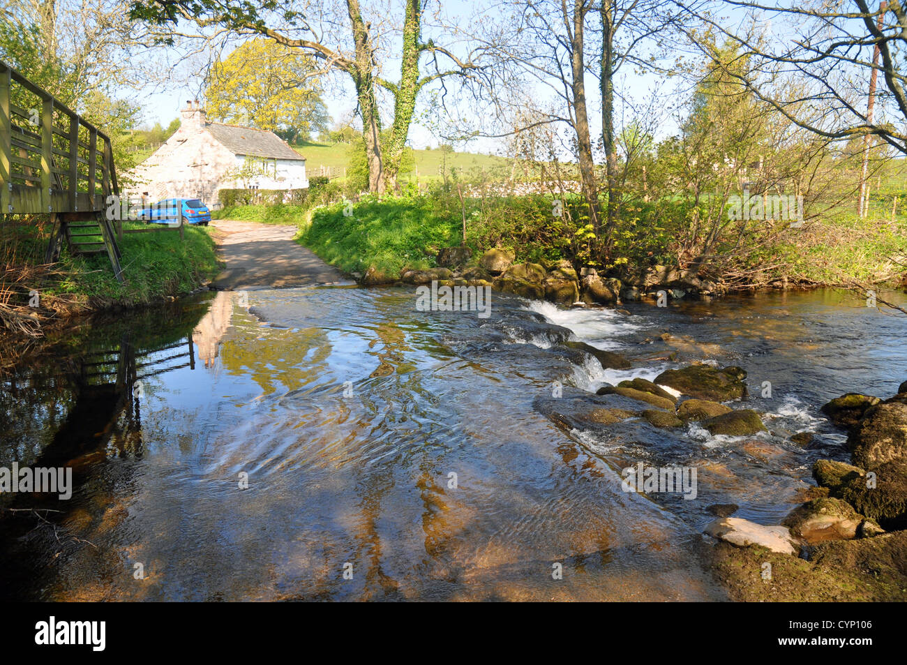 A ford through a stream near the town Stock Photo - Alamy