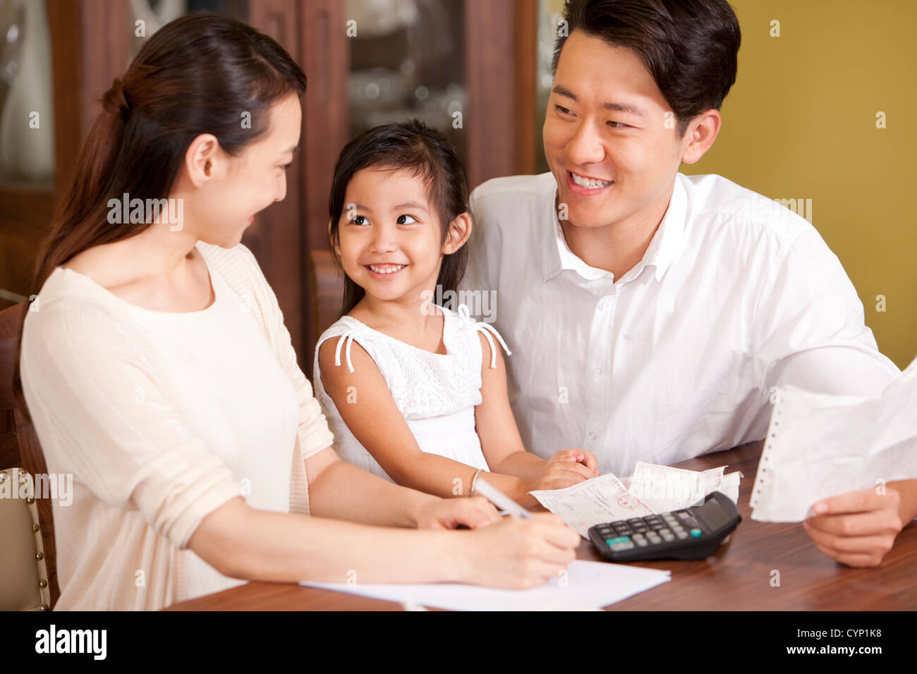 Family calculating bills together Stock Photo - Alamy