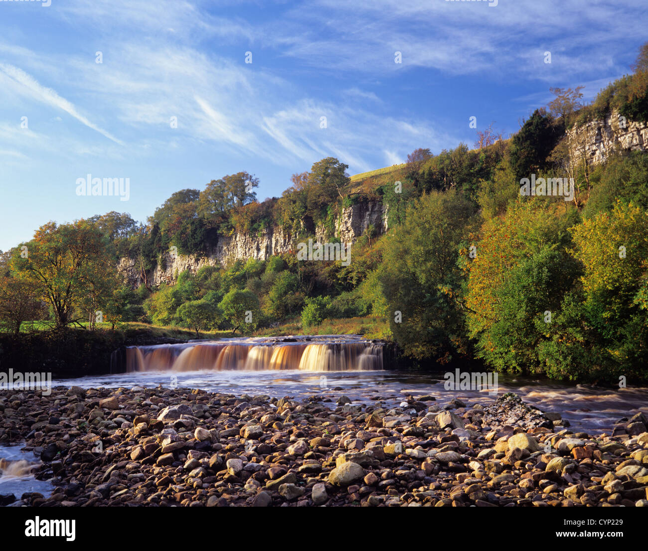 river swale flowing over wainwath force waterfall at autumntime ...