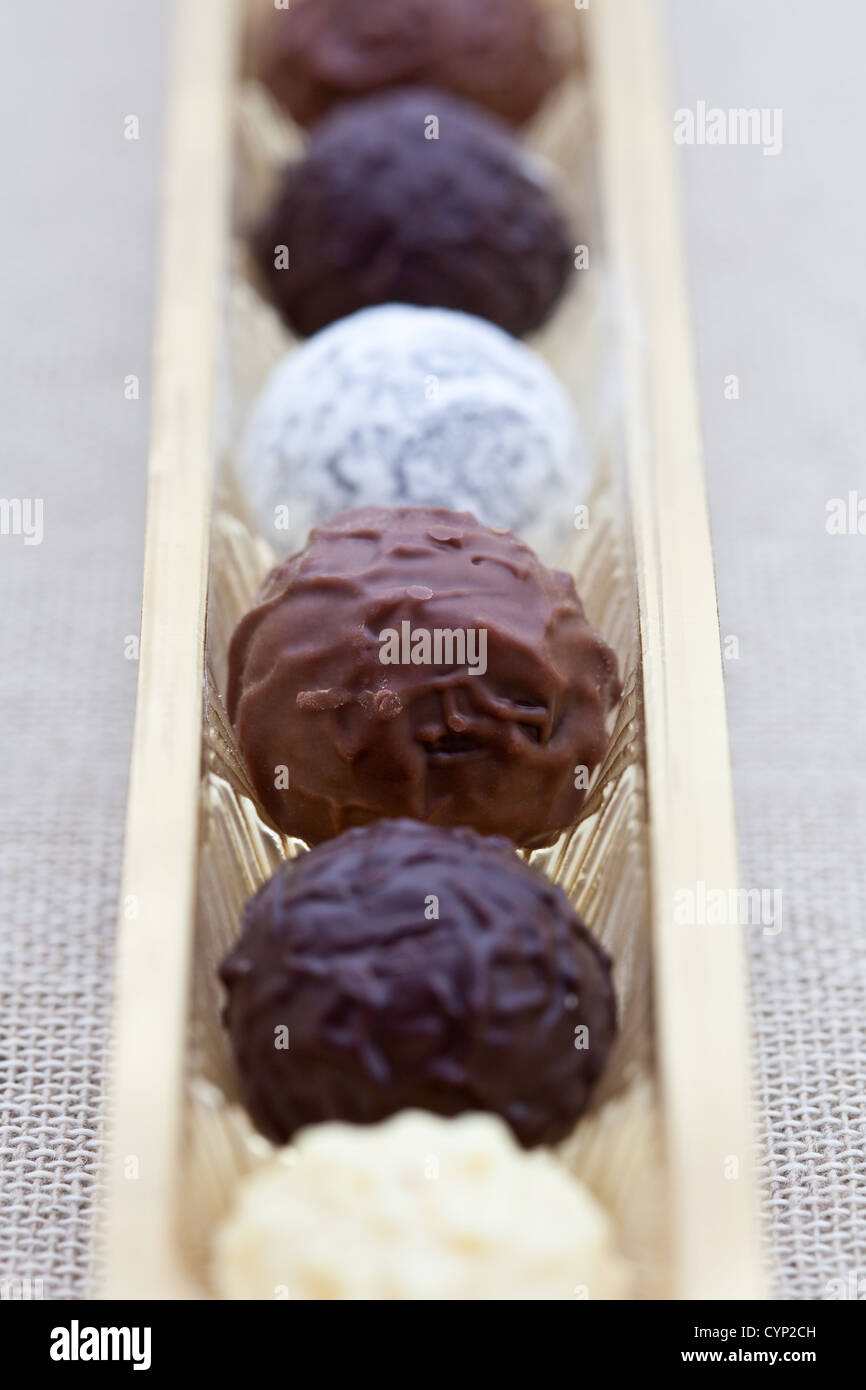 Row of assorted chocolate truffles Stock Photo - Alamy