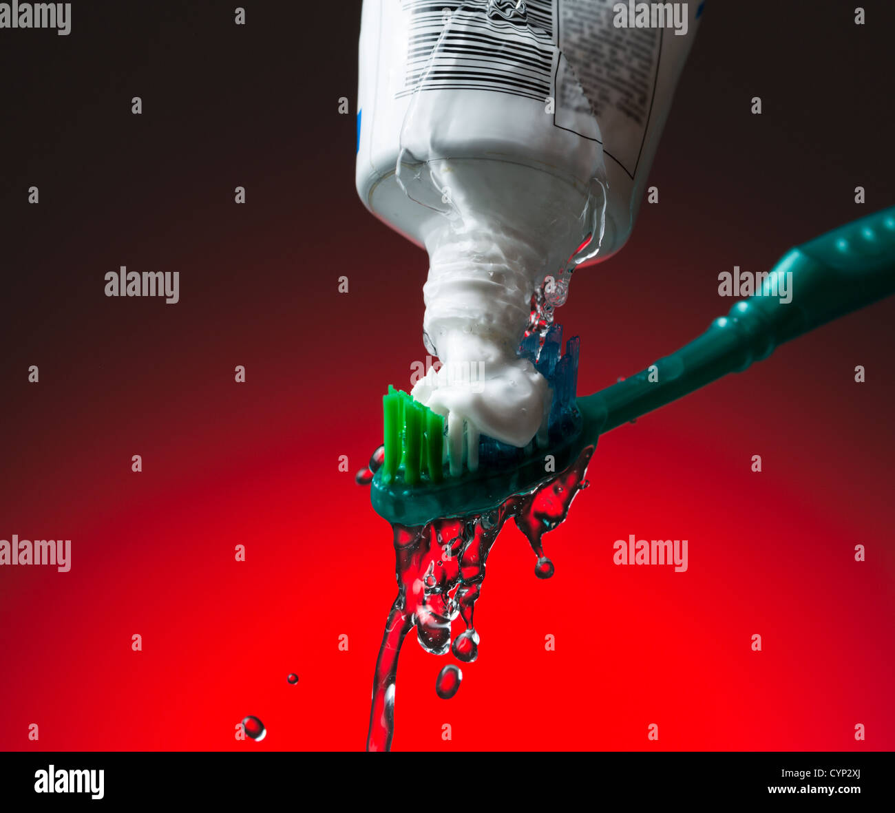 Toothbrush and toothpaste under stream of water Stock Photo - Alamy