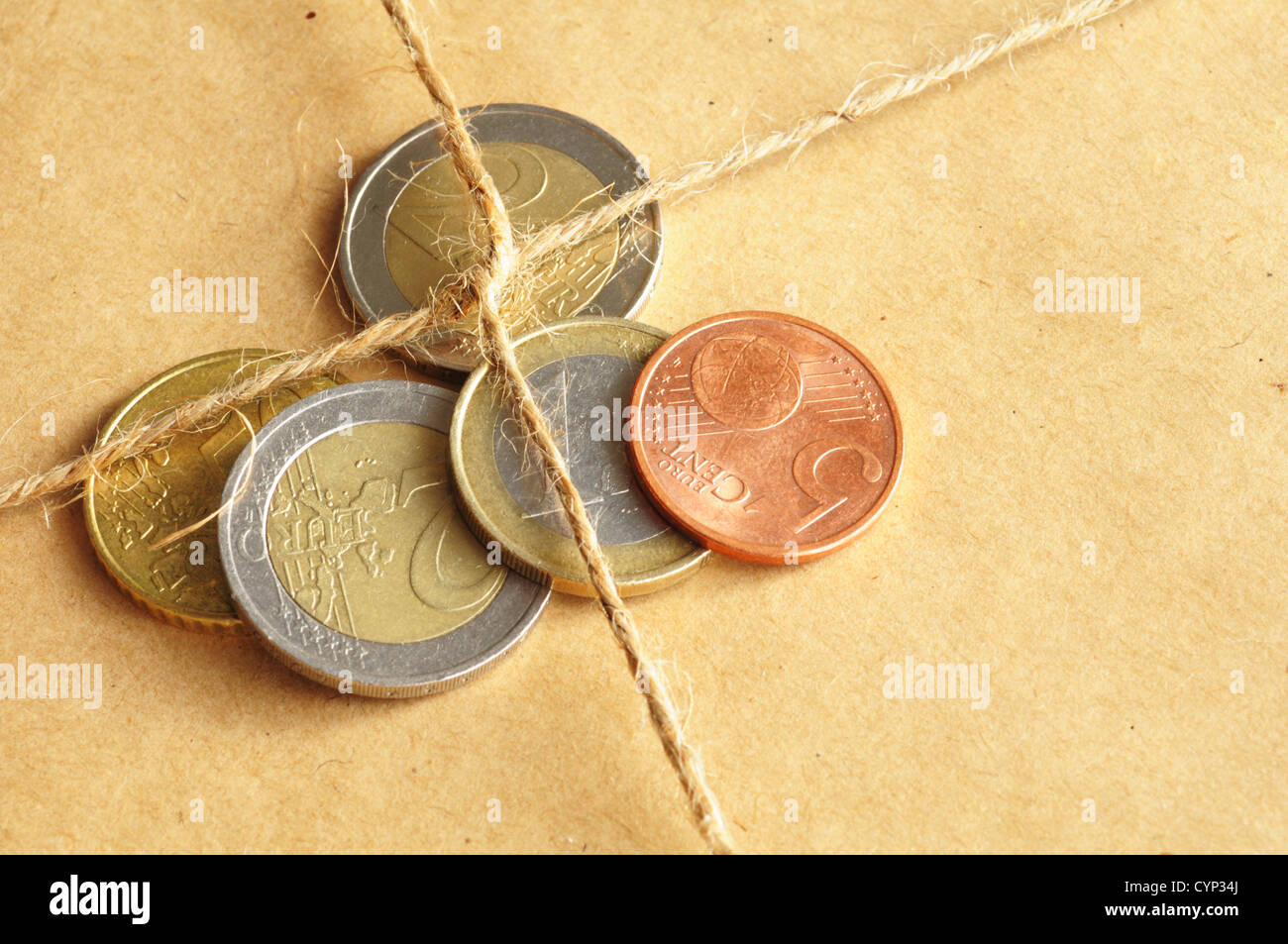 forwarding charges or shipping money concept with coins and parcel ...