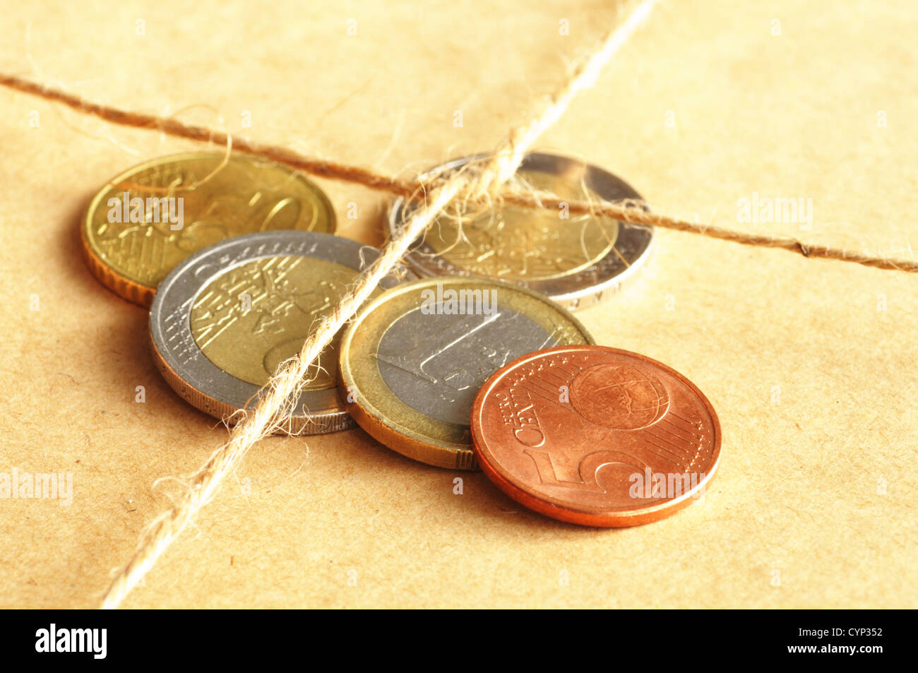 forwarding charges or shipping money concept with coins and parcel ...