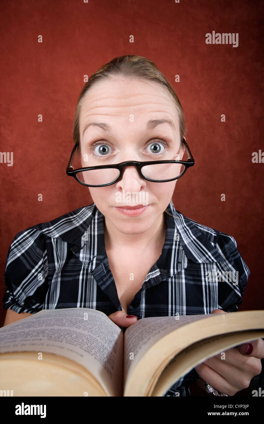 Woman big eyes glasses reading hi-res stock photography and images - Alamy