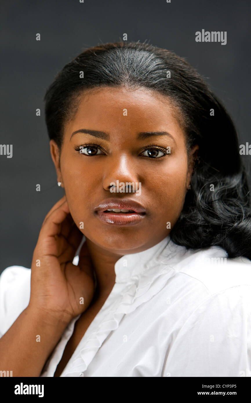Portrait of a beautiful African-America woman in white shirt Stock ...