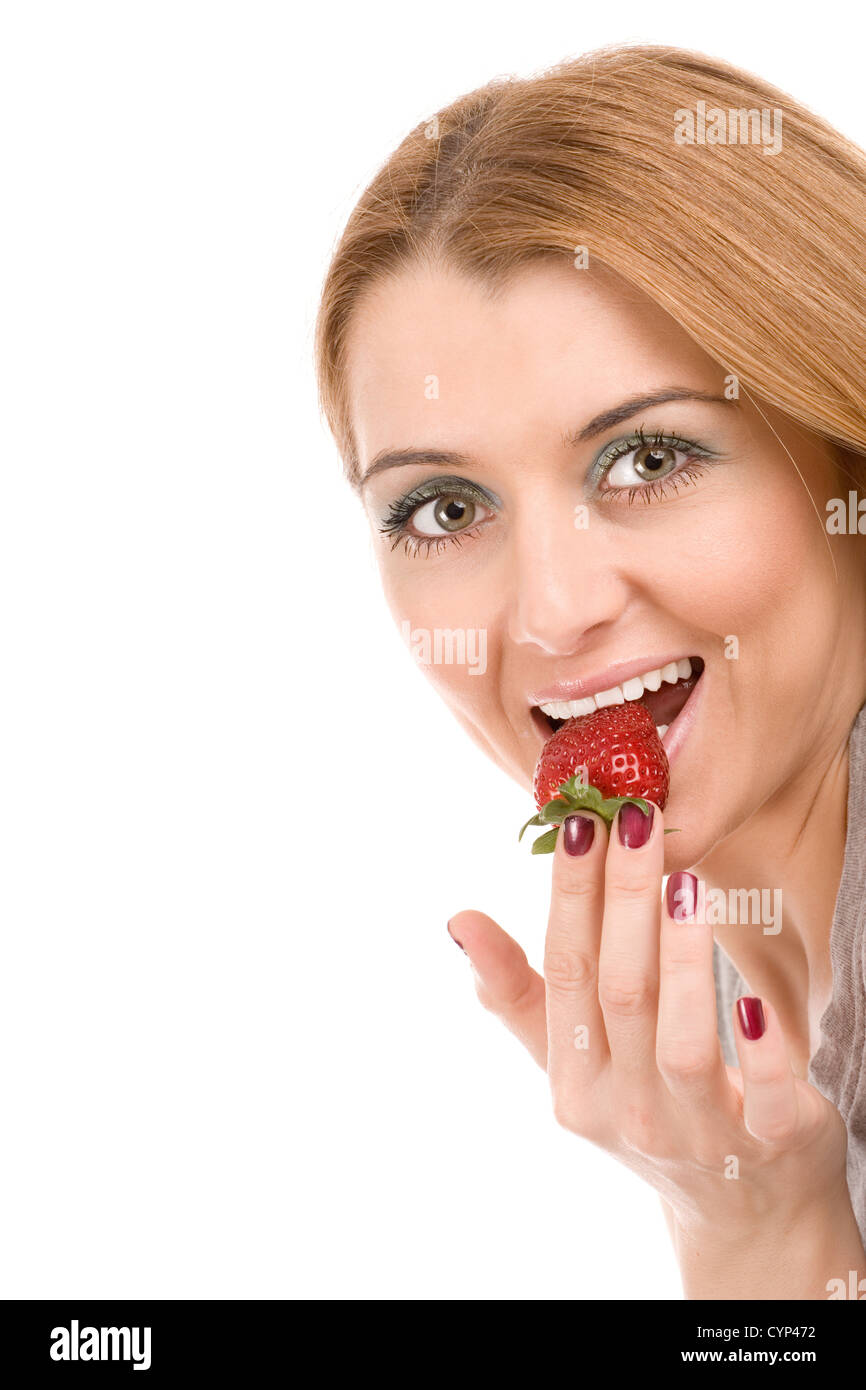 Beautiful girl eating strawberry Stock Photo - Alamy