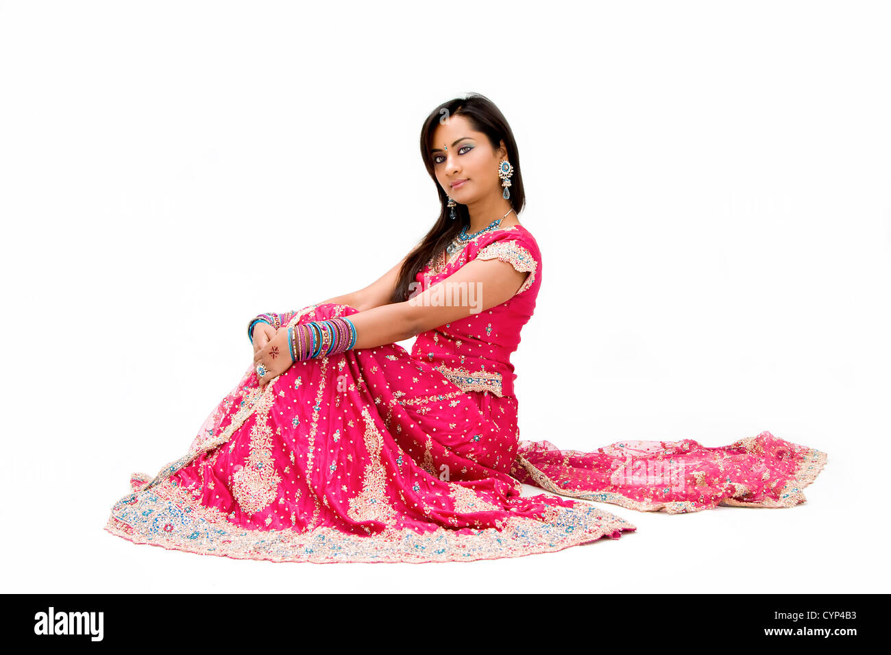Beautiful Bangali bride in colorful dress sitting, isolated Stock Photo ...