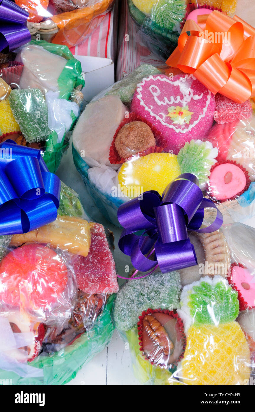 Colourful sweets wrapped and tied with brightly coloured ribbon hi-res ...