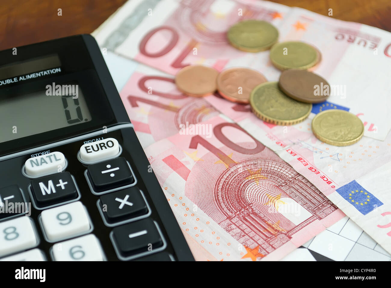 calculator and money Stock Photo - Alamy