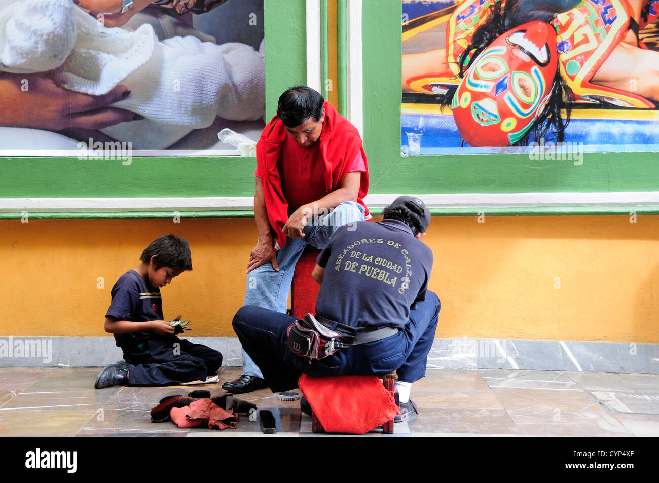 Shoeshine stand in front of posters. American Hispanic Latin America ...