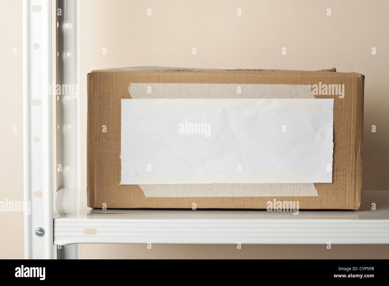 Cardboard box with blank label. Moving, storage concept Stock Photo - Alamy