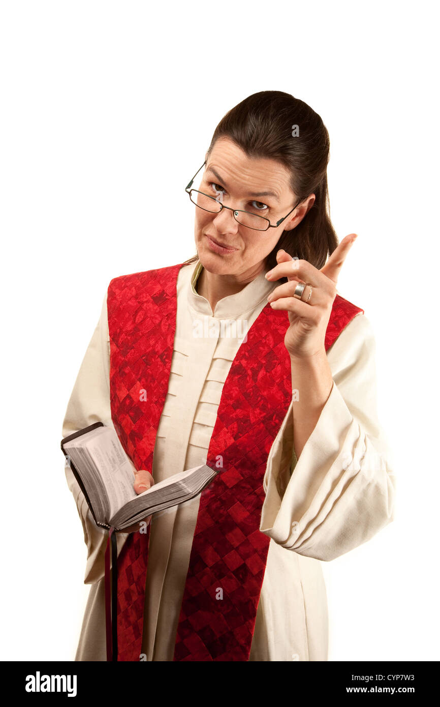 Pastor in white robes with Bible and red stole Stock Photo - Alamy