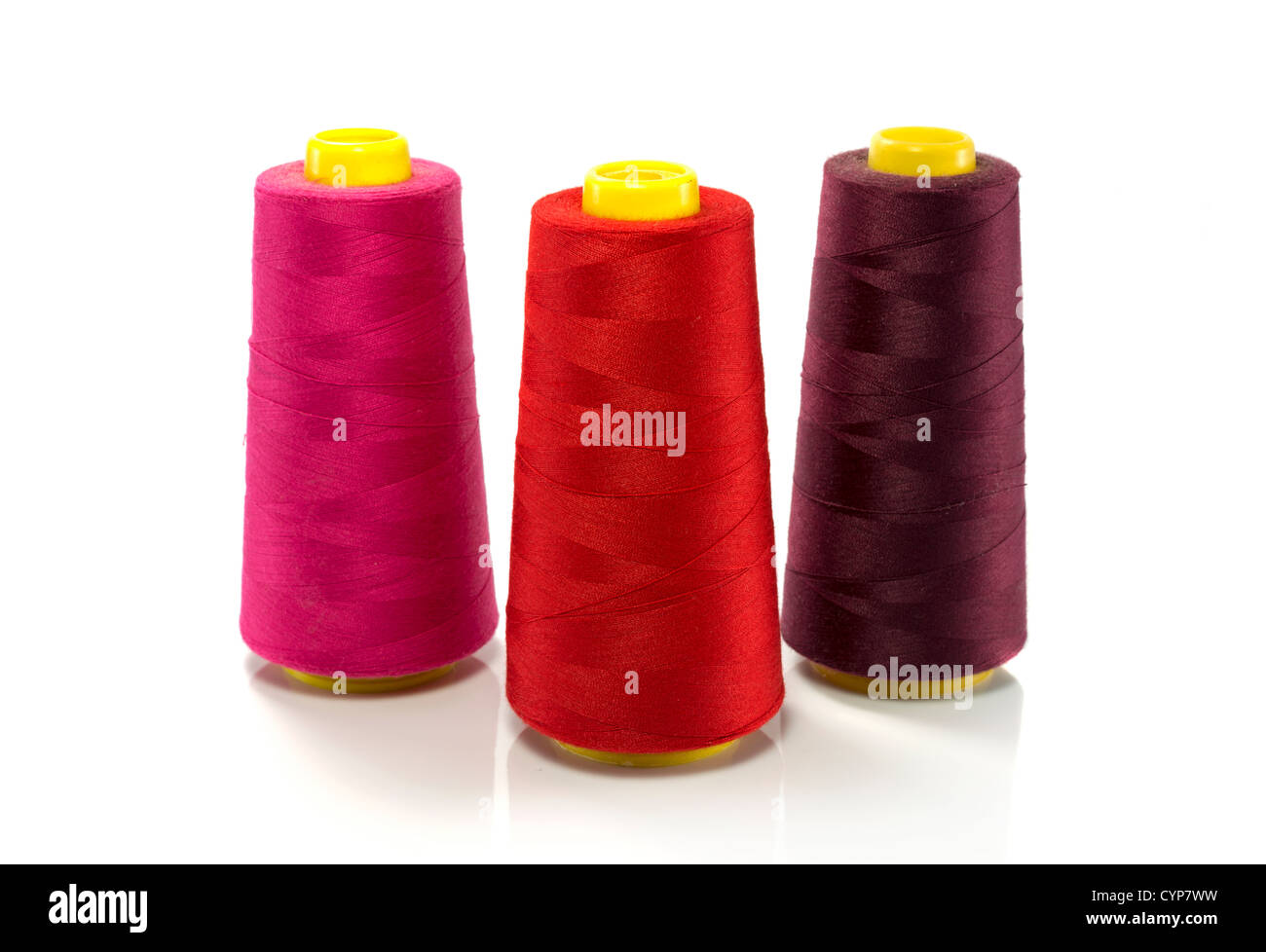 red pink and purple bobbin with thread isolated on white Stock Photo ...