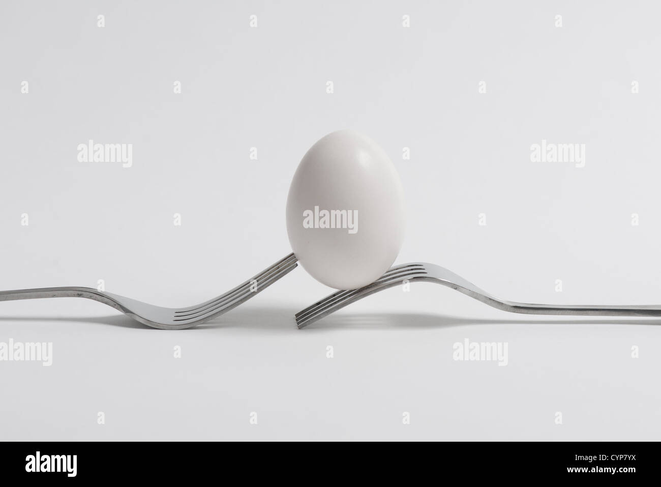 Fork with egg Stock Photo - Alamy