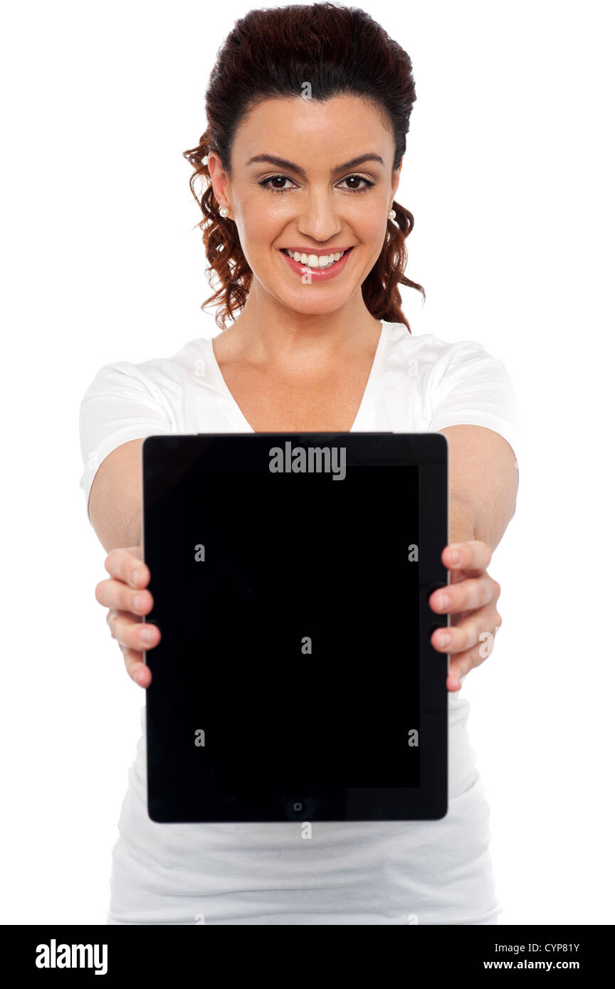 Woman holding tablet device, showing it to camera. Al on white ...