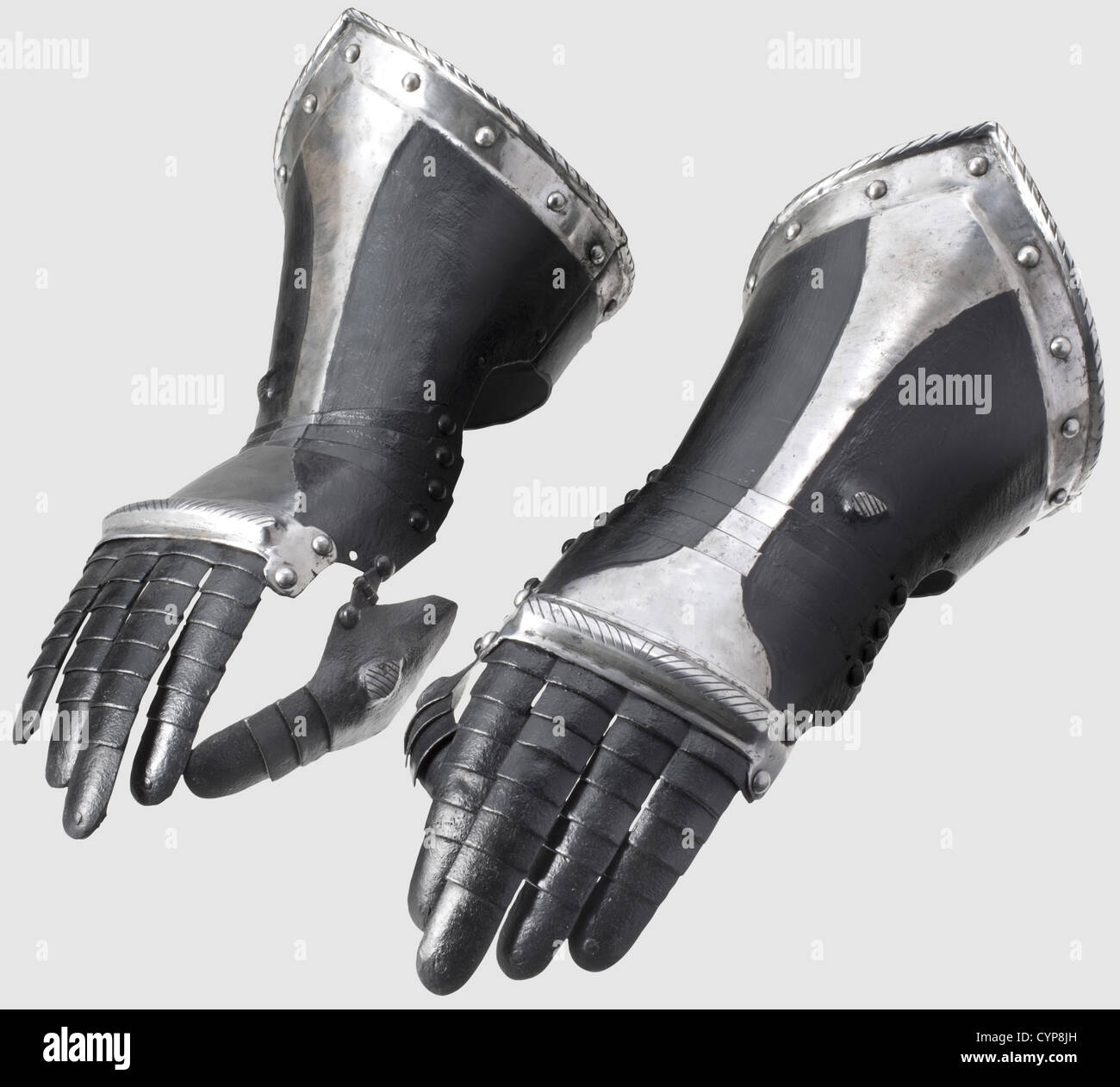 A pair of German black and white gauntlets, circa 1580. Metacarpus of ...