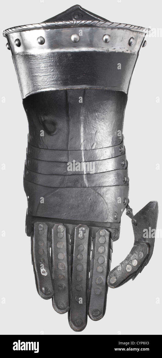 A pair of German black and white gauntlets, circa 1580. Metacarpus of ...