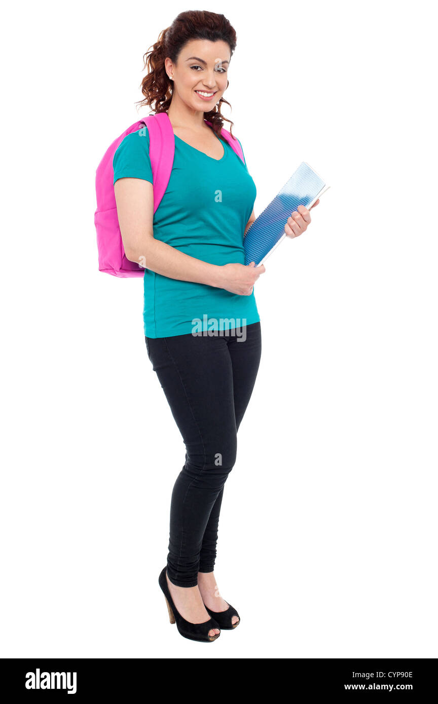 Attractive student with backpack and spiral notebook. Full length ...